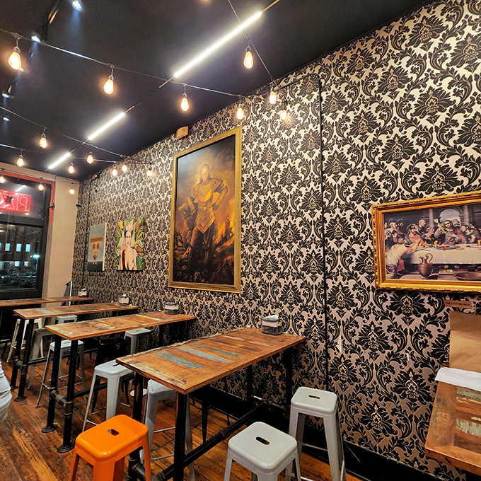 Black and white damask wallpaper adds unexpected elegance to the dining room &ndash; like your coolest aunt who pairs pearls with her leather jacket.