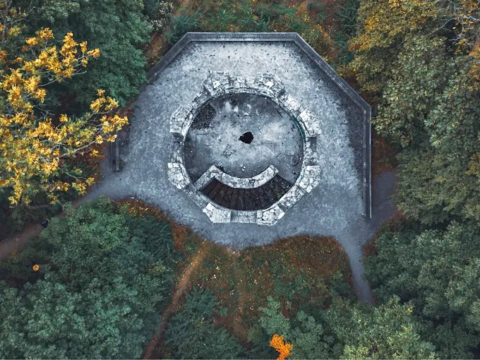 Bare winter branches reach toward the sky, framing this peculiar Ohio landmark that seems transported from another century.