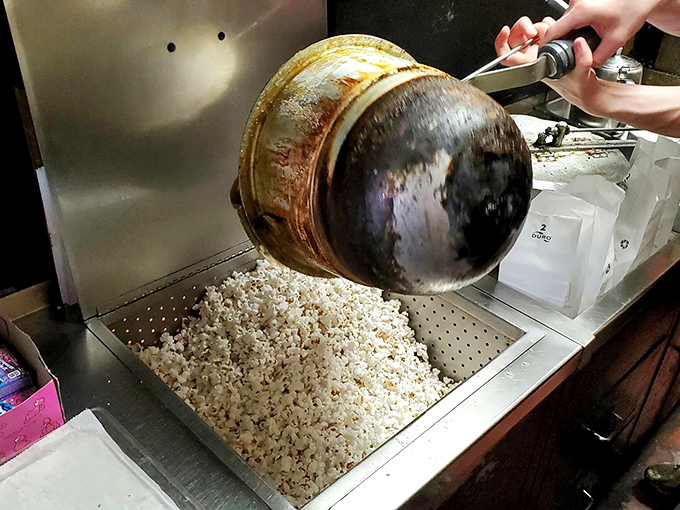 The ancient popper transforms humble kernels into edible joy, a process that's remained deliciously unchanged while the world outside has transformed completely.