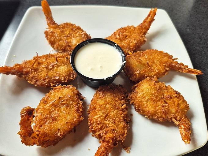 Coconut shrimp that transport you from Wisconsin waters to tropical shores, golden-fried to perfection and arranged like a sunburst on the plate.