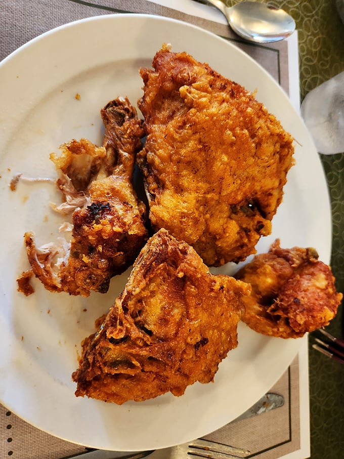 Crispy fried chicken with a golden crust that shatters satisfyingly, revealing juicy meat that falls off the bone with barely a nudge.