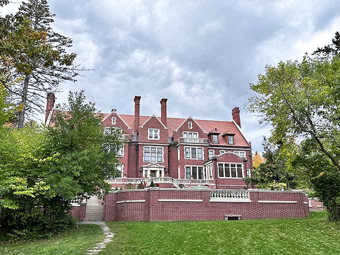 Glensheen Historic Estate stands as a monument to Gilded Age opulence, its red-brick Tudor fa&ccedil;ade hiding 39 rooms of preserved early 20th-century grandeur.