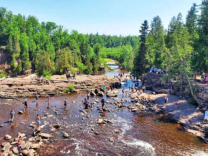 Summer brings families to wade in the shallow pools below the falls, creating memories that will outlast any theme park visit.