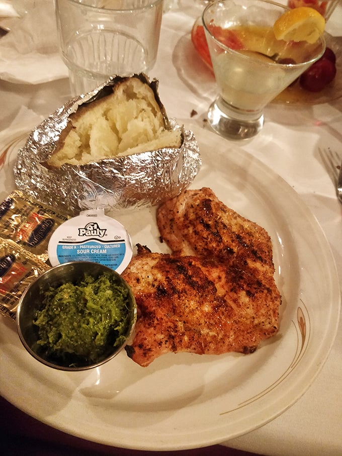 Tender chicken breast with a side of vibrant chimichurri &ndash; proof that Mancini's excellence extends beyond beef.