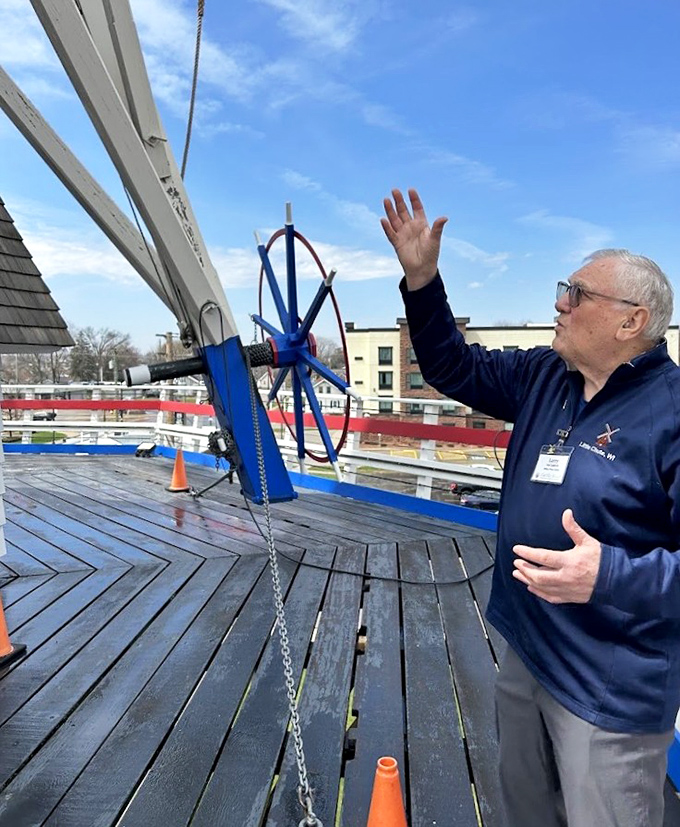 A knowledgeable guide demonstrates the windmill's mechanics, bringing centuries-old technology to life with passionate storytelling.