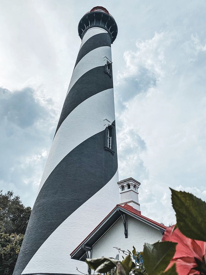 The lighthouse's powerful beam cuts through darkness, just as it has since 1874. Some say more than just light emanates from this historic tower.