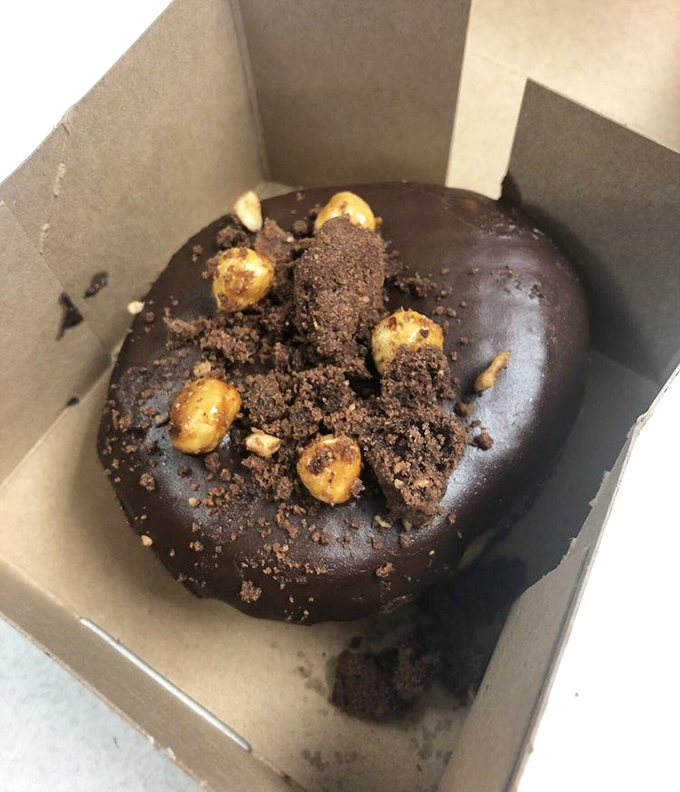 Chocolate lovers, rejoice! This hazelnut-topped creation combines rich cocoa glaze with crunchy nuts for a textural symphony that sings in your mouth.