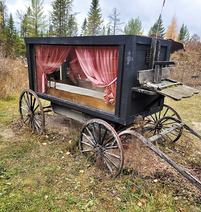 That vintage hearse wagon with its velvet curtains reminds us that even in the Wild West, you still dressed up for your final ride.