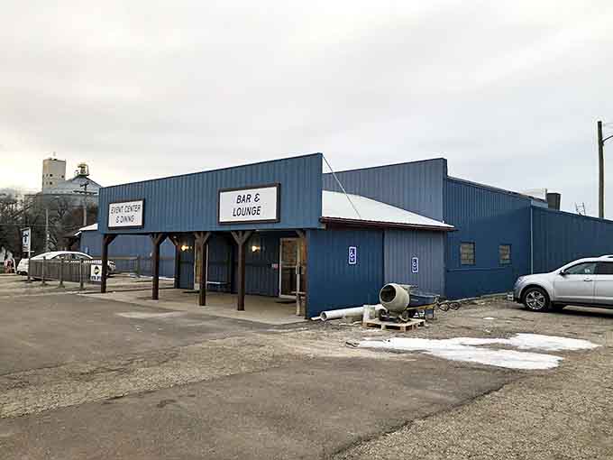 The Hilltop Bar & Grill offers a welcoming blue exterior, promising comfort food and friendly conversation after a day of gnome-spotting.