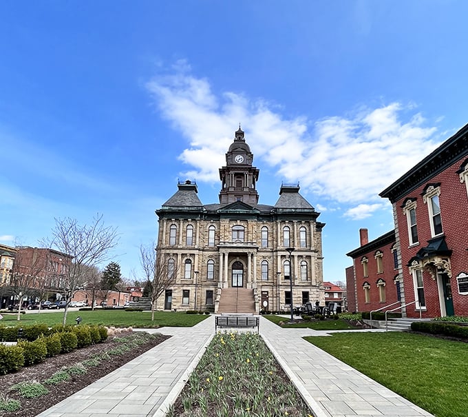 Holmes County Courthouse commands attention with its stately presence, a sandstone sentinel watching over downtown since 1885.