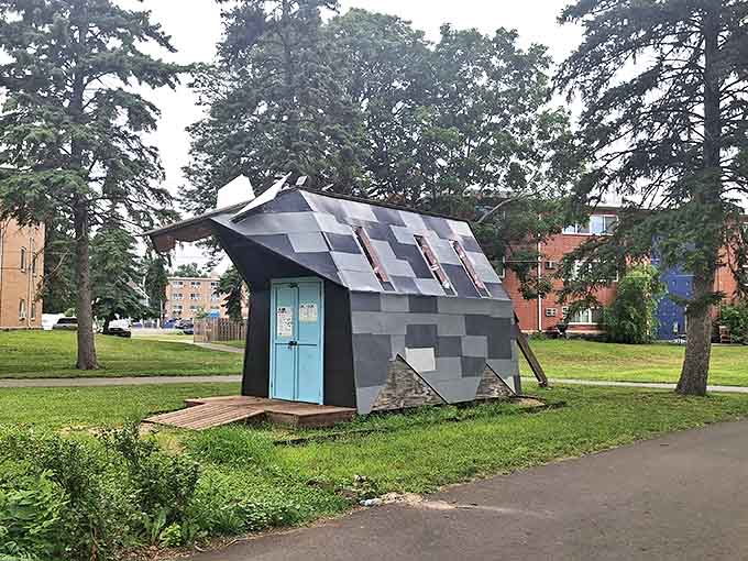 This pixelated house sculpture looks like it hasn't fully downloaded yet &ndash; architecture caught between digital and physical worlds.