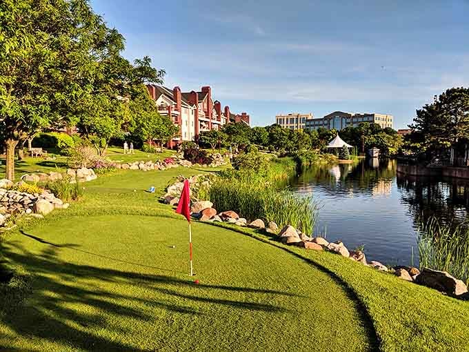 Mini-golf enthusiasts putt their way through landscaped perfection, where each hole is framed by water features and natural stone that puts carnival courses to shame.