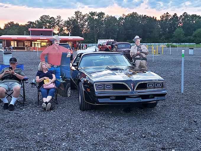 Classic cars and movie character cutouts create perfect photo opportunities, blending automotive nostalgia with cinematic history in delightful ways.