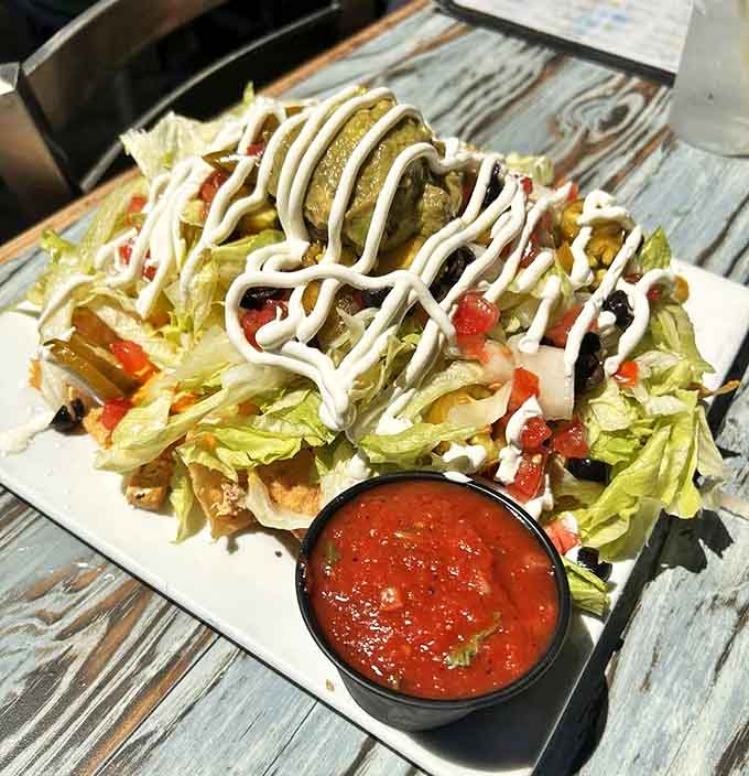 These loaded nachos aren't messing around &ndash; crispy chips disappear beneath mountains of toppings and rivers of cheese in this shareable crowd-pleaser.