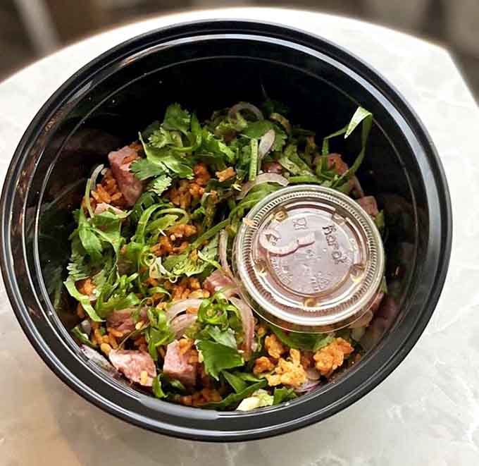 Naem khao brings the party with crispy rice, herbs, and peanuts &ndash; each spoonful a textural wonderland of crunch and chew.