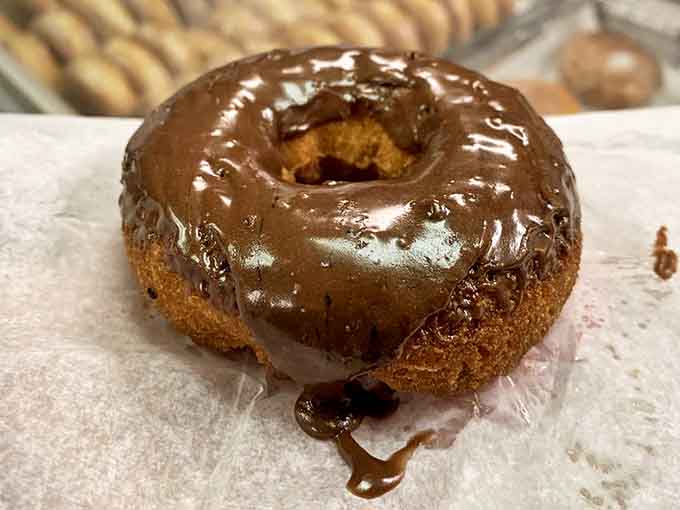 Chocolate donut nirvana: where rich cocoa glaze meets pillowy dough in a marriage that would make Willy Wonka weep with joy.
