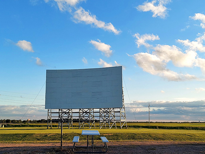 Standing tall against Minnesota's big sky, the screen waits patiently for sunset to transform into a storyteller's canvas.