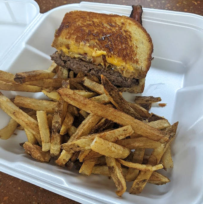The Patty Melt transforms the humble grilled cheese into something transcendent with seasoned beef and caramelized onions.