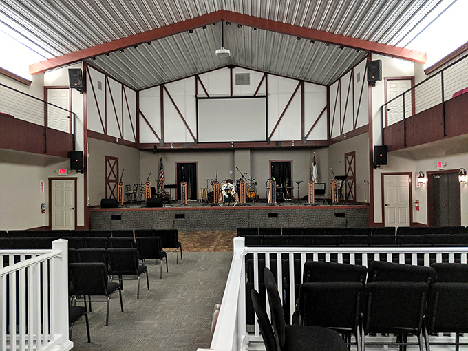 This community gathering space combines rustic charm with practical simplicity, hosting everything from hymns to community meetings.