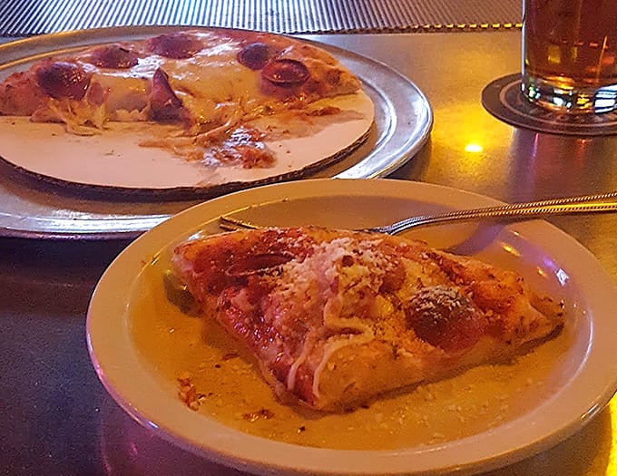 Cups of crispy-edged pepperoni create little pools of savory goodness across the landscape of this Detroit-style beauty.