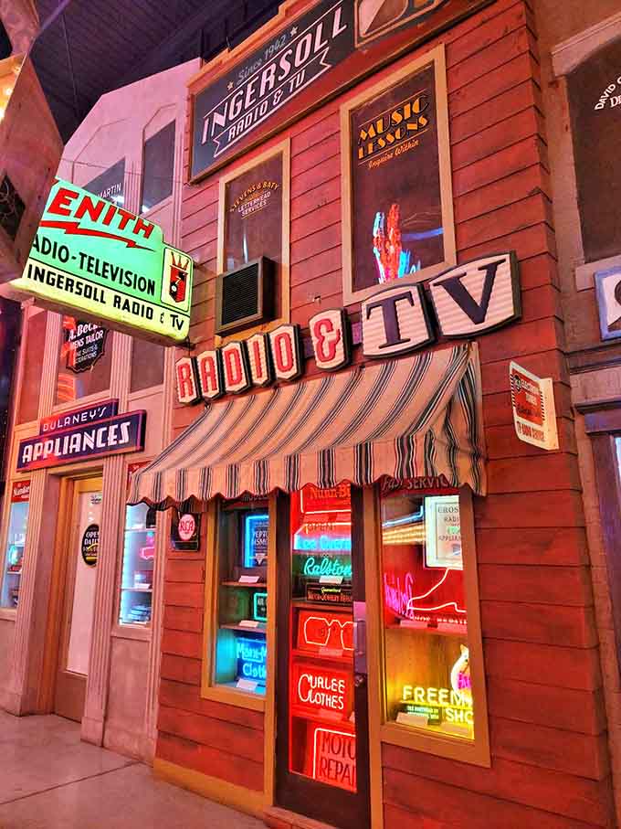 Remember when buying a television was a major family event? This storefront captures that bygone era of rabbit ears and console sets.
