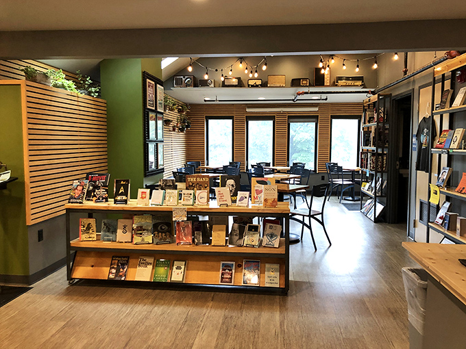 Natural light floods the main floor, creating the perfect reading atmosphere as customers browse between wooden shelves.