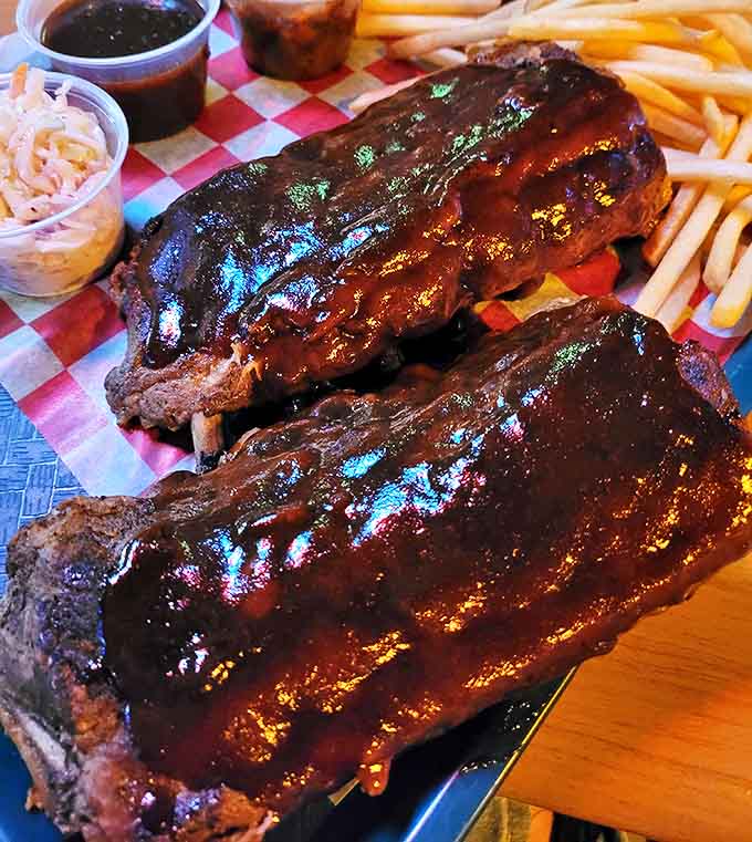 Fall-off-the-bone ribs slathered in house barbecue sauce &ndash; where napkins are merely a suggestion and finger-licking is practically mandatory.