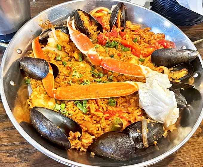 A mountain of saffron rice studded with ocean treasures &ndash; this isn't just dinner, it's a Caribbean expedition on a plate.