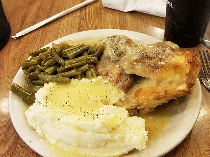 Golden chicken breast with green beans and mashed potatoes proves that sometimes the simplest preparations yield the most satisfying results on your plate.