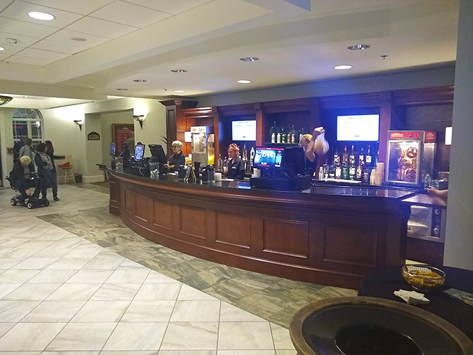 Behind the curved wooden bar, friendly staff prepare drinks with flair, adding to the Capitol's reputation for service that matches its architectural splendor.