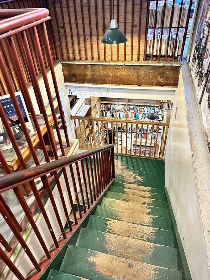 The well-worn staircase leads adventurous readers between floors, each step promising new literary territories to discover.