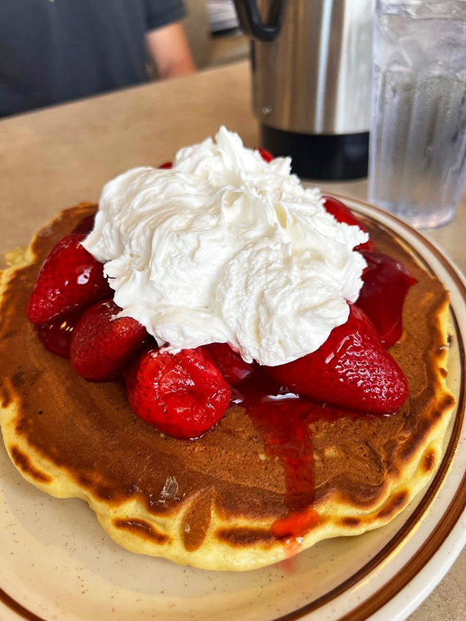 Strawberry fields forever! These ruby-red berries nestled on pancakes with whipped cream clouds create a breakfast worth singing about.