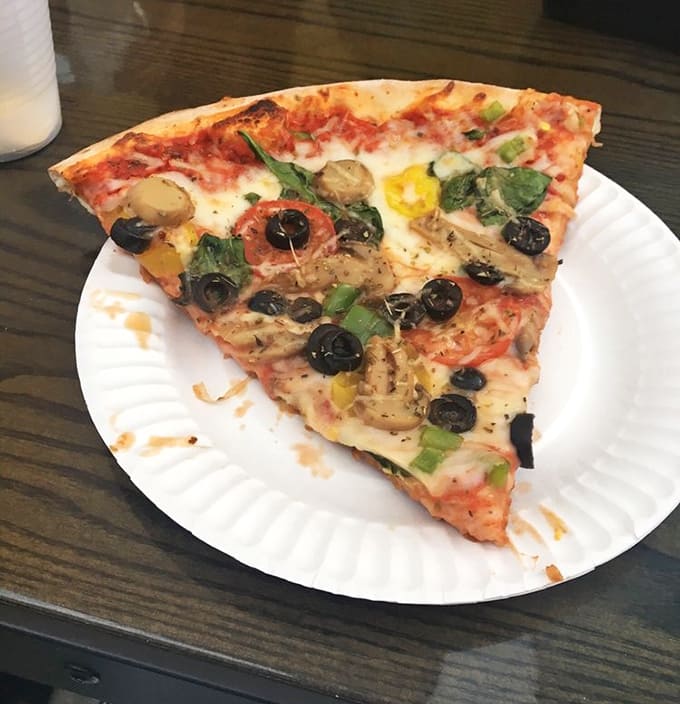 The Supreme slice &ndash; a colorful mosaic of toppings that somehow maintains structural integrity despite being loaded with veggie goodness.