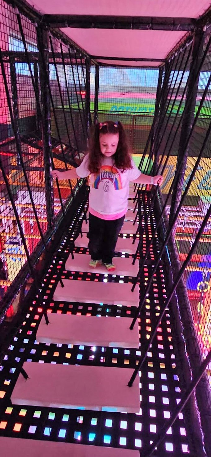 The suspension bridge tests both balance and courage, creating a wobbly path where every successful step feels like a personal victory.