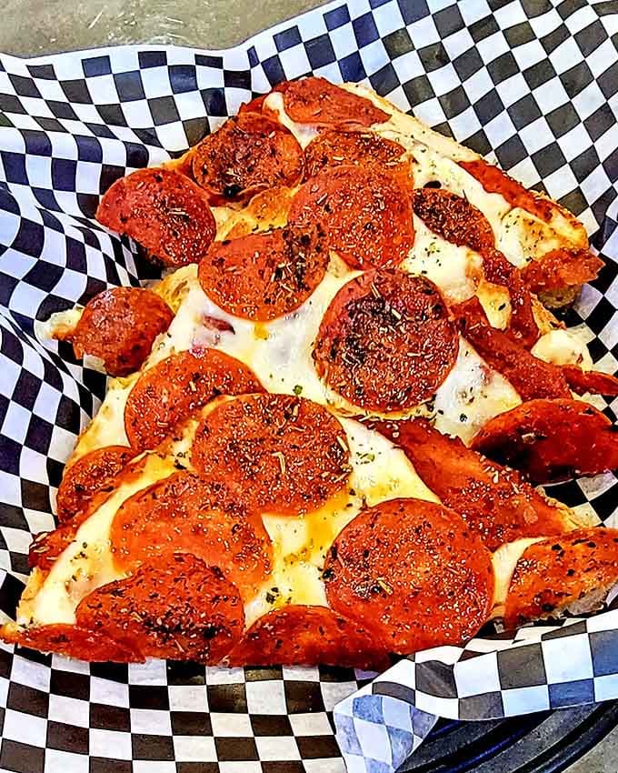 This pepperoni pizza slice might be small in stature, but it delivers big flavor with its melty cheese and crispy edges.