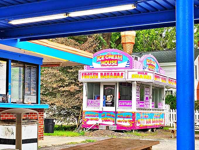 The Ice Cream House stands like a purple-and-white dream factory, promising frozen delights to complement your burger adventure.