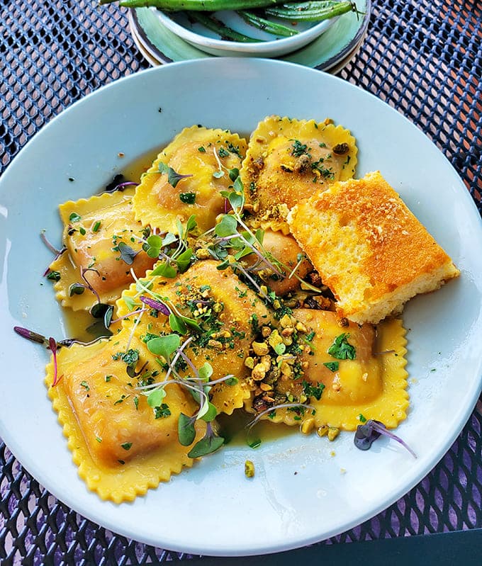 Butternut squash ravioli that looks like sunshine on a plate, with each pillow of pasta promising a burst of autumn flavors.