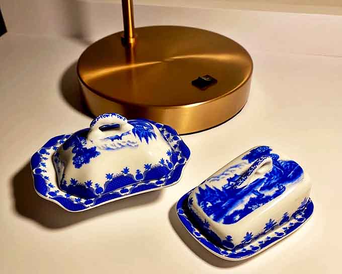 Delicate blue and white miniature tea sets await tiny imaginary parties, their diminutive charm irresistible to collectors of all ages seeking dollhouse perfection.