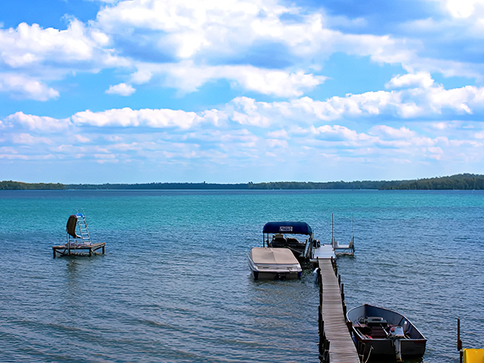 Lakeside living at its finest: a wooden dock extends into Deer Lake's calm waters, offering the perfect sunset viewing platform.