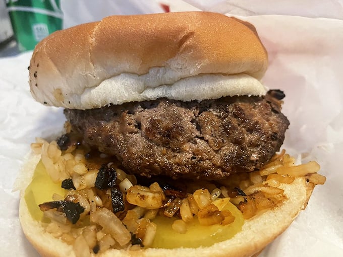 A classic burger with grilled onions represents the straightforward, no-nonsense approach that's made Matt's famous for generations.
