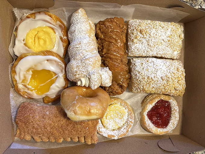 This box of assorted pastries isn't just dessert &ndash; it's a choose-your-own-adventure of butter, sugar, and fruit that makes adulting worthwhile.