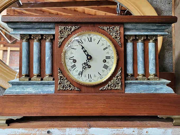 This stately mantel clock with its columned facade doesn't just tell time – it practically narrates it with Victorian authority.