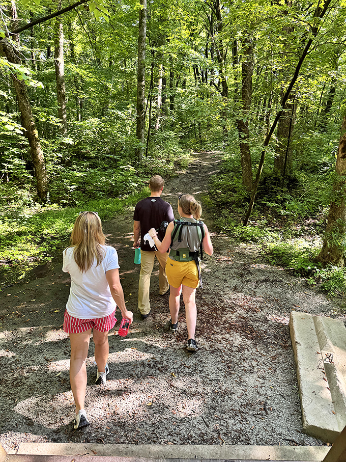 Fellow explorers venture deeper into the forest, where cell service fades and real connection begins.