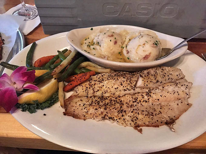 Minnesota's beloved walleye gets the royal treatment, served alongside vibrant vegetables that brighten both the plate and your day.