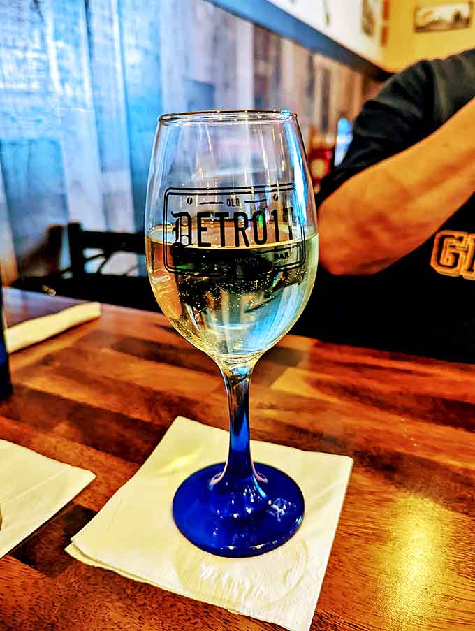 Even the glassware gets the branded treatment, making that crisp white wine taste just a little more special against the blue-stemmed logo glass.