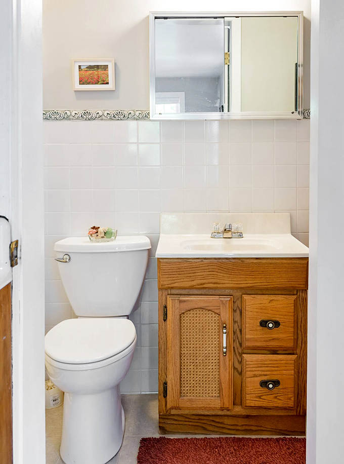 Even the bathroom maintains that perfect balance of vintage charm and modern convenience, no outhouse experience required!