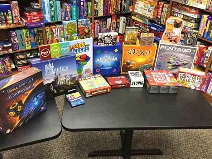 An impressive spread of games awaits new players, each box a doorway to different worlds of strategy, luck, and imagination.