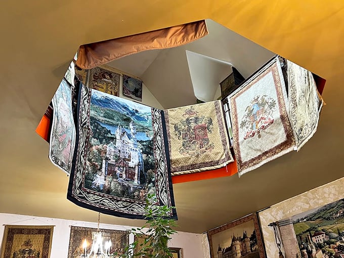 Colorful tapestries hang from an octagonal ceiling, creating a kaleidoscope of medieval artistry that transforms ordinary space into extraordinary experience.