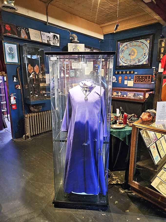 This striking purple ceremonial robe stands sentinel in its glass case &ndash; imagine the rituals it witnessed in its previous life!