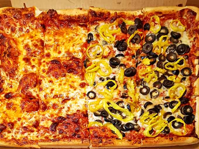Half cheese, half adventure! This pizza showcases the perfect balance of melty cheese alongside olives and banana peppers for those who like a flavor kick.
